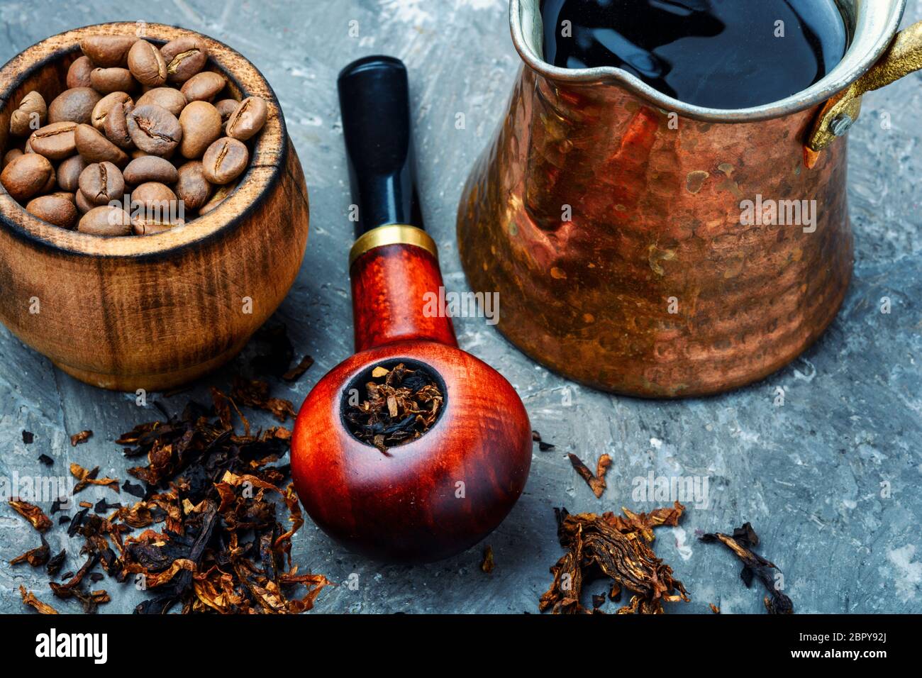 Stylish tobacco pipe with tobacco and brewed coffee Stock Photo - Alamy