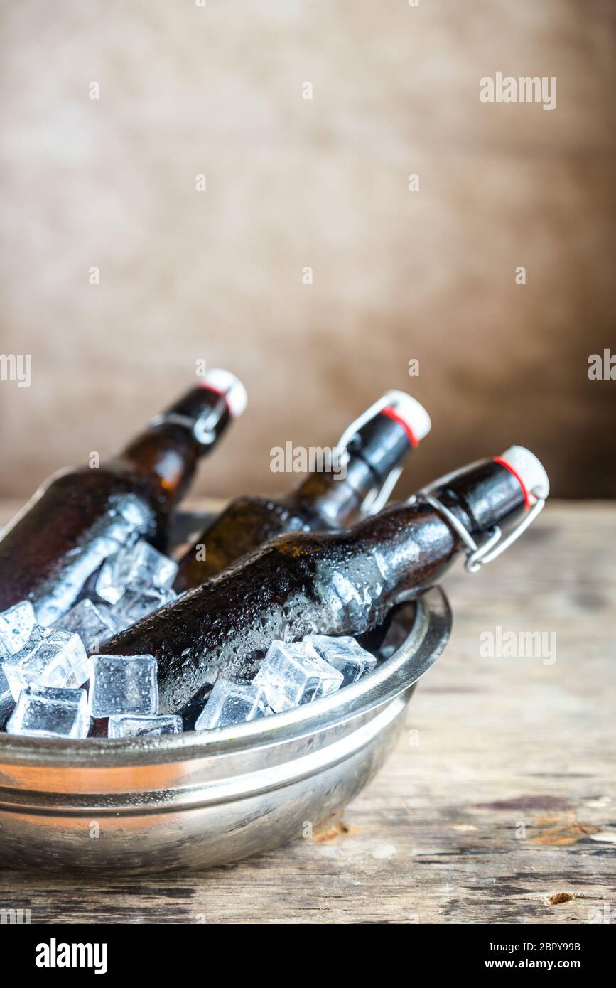 Bottles of beer in ice cubes Stock Photo - Alamy