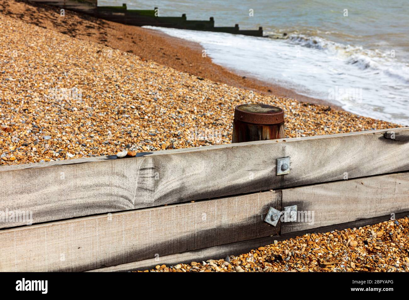 Wave patterns in the wooden groynes on Kingsdown beach reflect the wave ...