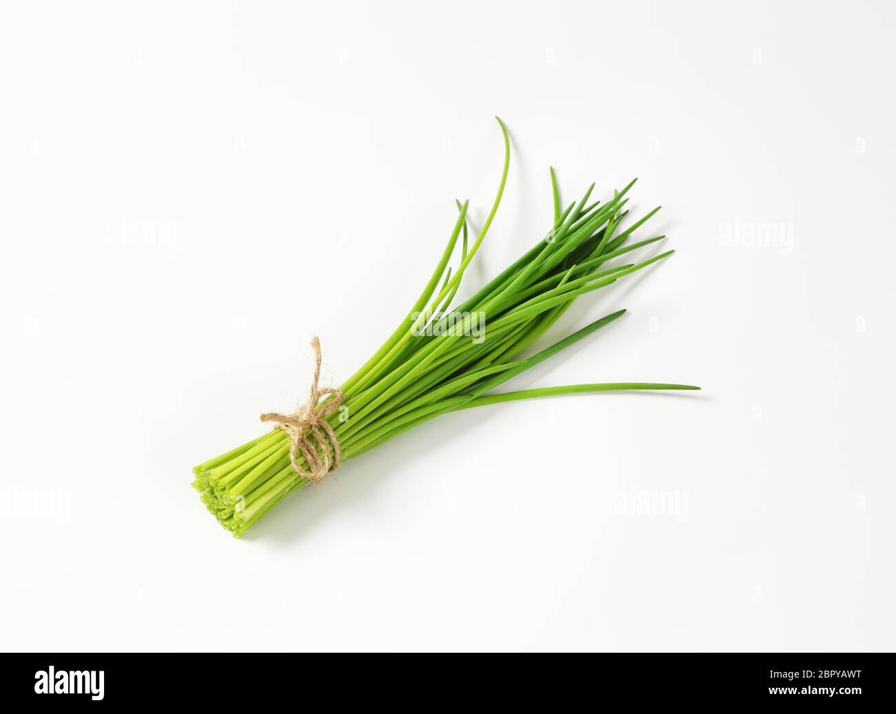 Bunch of fresh chives on white background Stock Photo - Alamy
