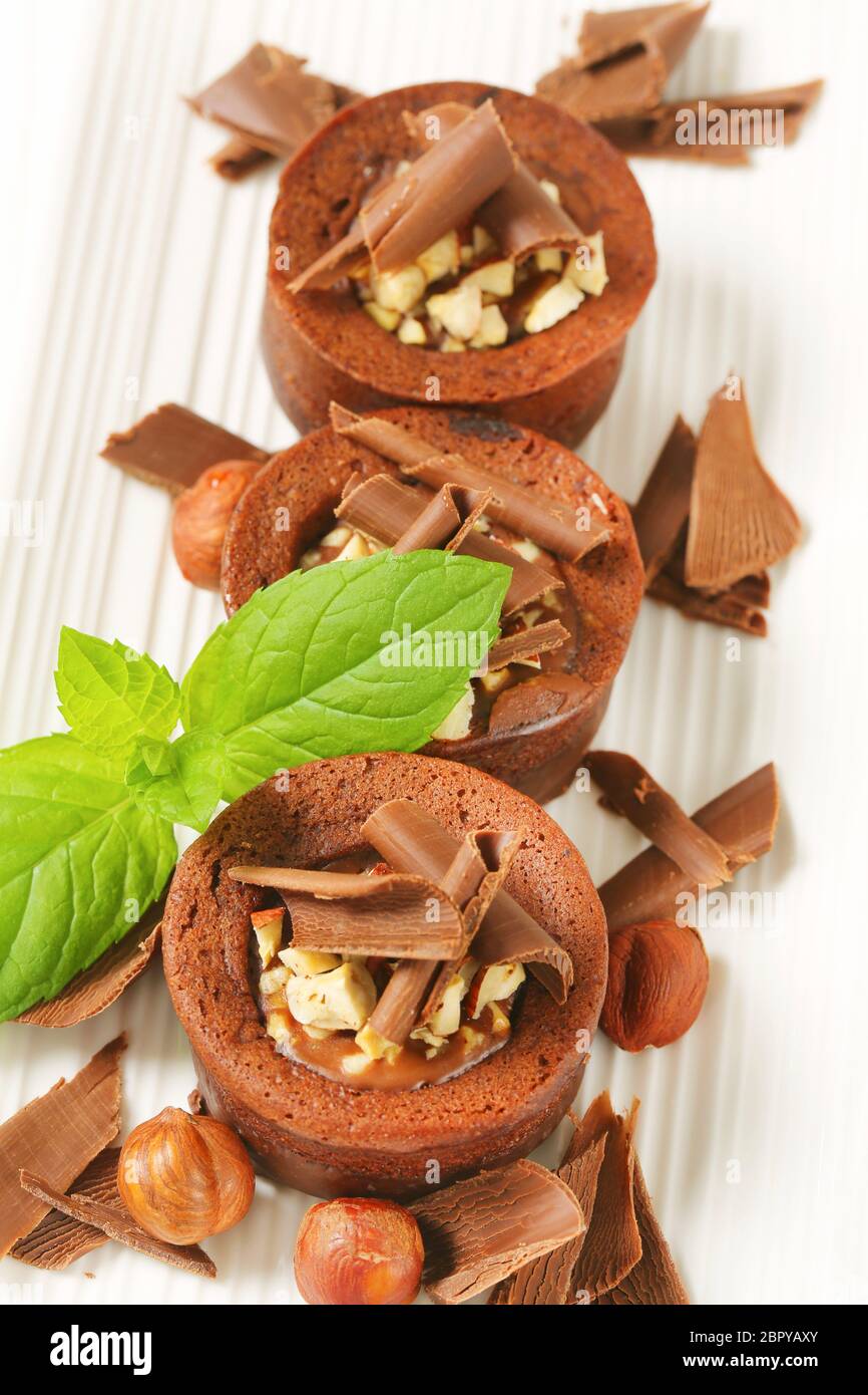 Mini chocolate cakes with hazelnut filling Stock Photo - Alamy