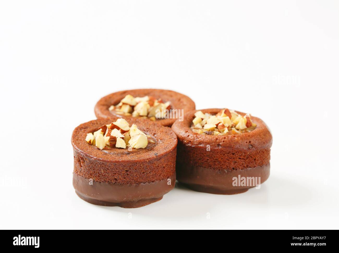 Mini chocolate cakes with hazelnut filling Stock Photo - Alamy