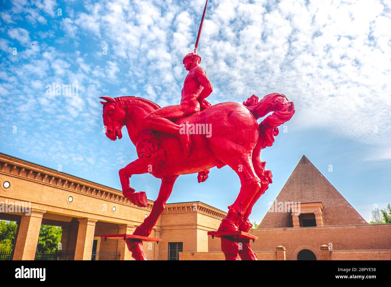red knight and horse with pyramid background at the Masone Labyrinth ...