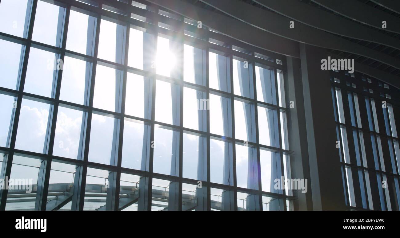 Airport window with sunlight flare Stock Photo - Alamy