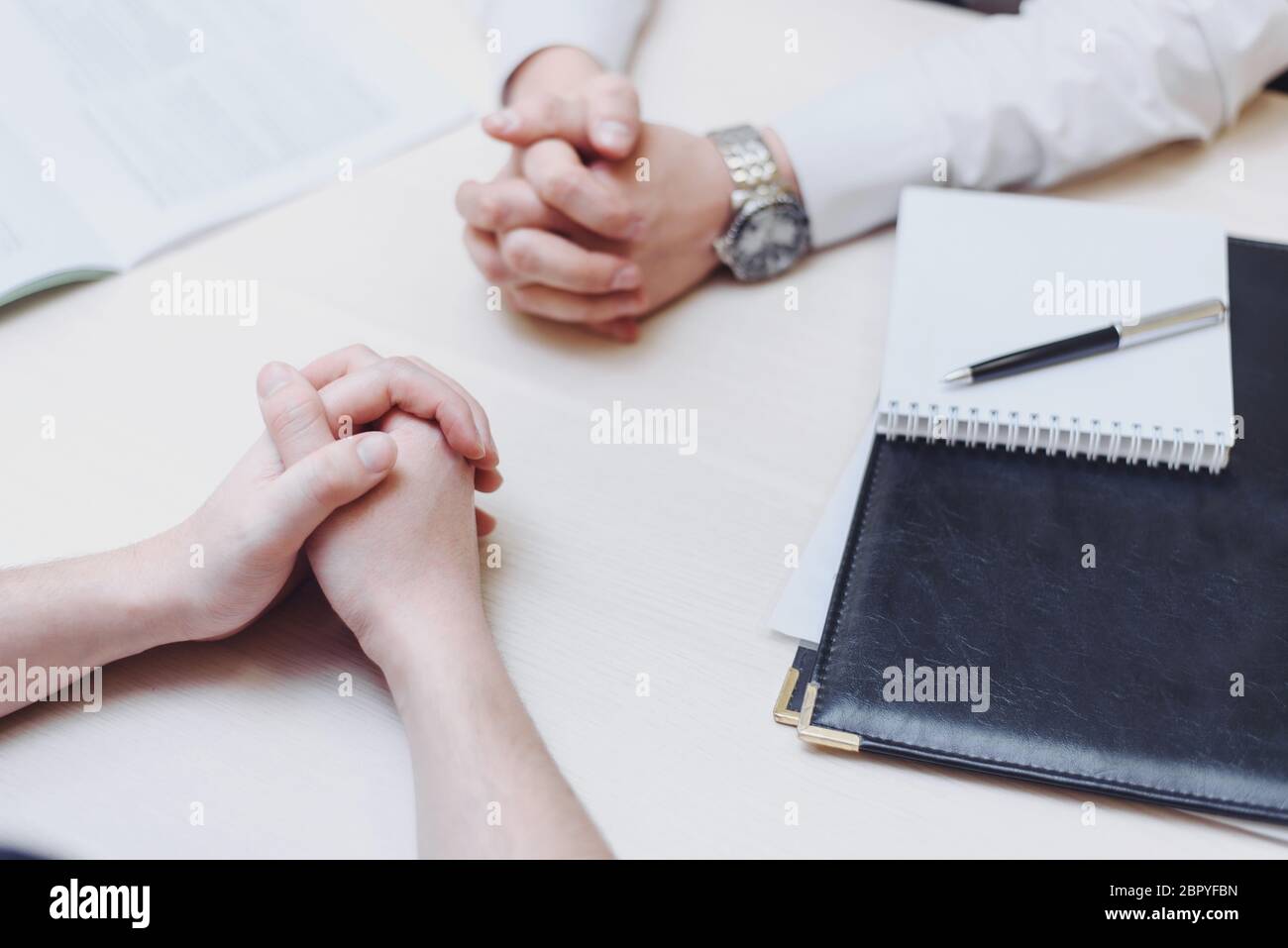 Hand, two men on a desk. Negotiating business. Communication and ...