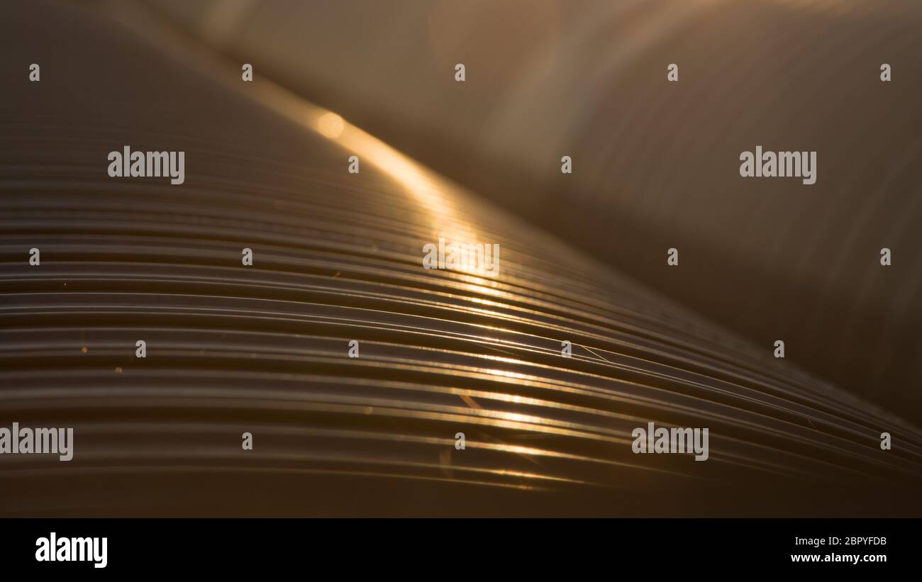 Golden metal pipes closeup background Stock Photo - Alamy