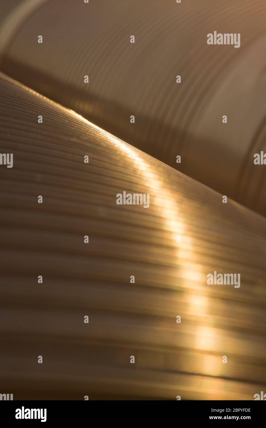 Golden metal pipes closeup background Stock Photo - Alamy