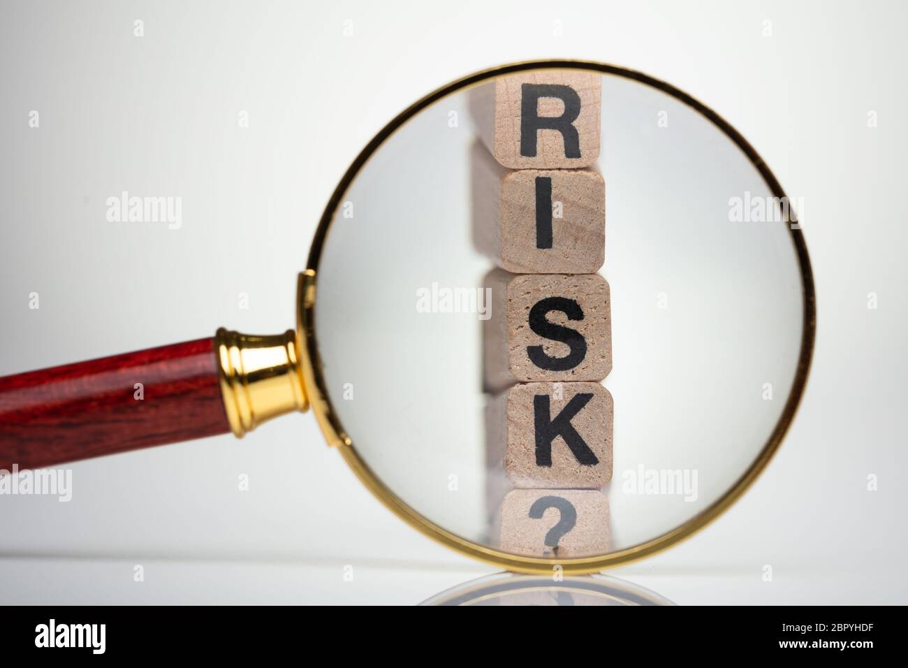 Risk word magnifying glass hi-res stock photography and images - Alamy