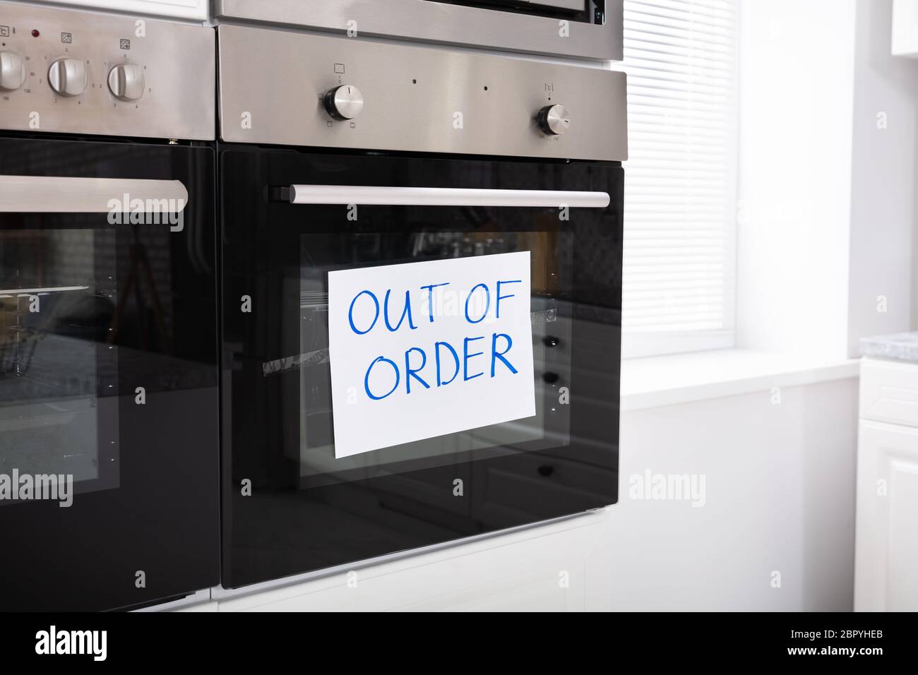 Written Text Out Of Order Message On Paper Over The Stuck Oven In ...
