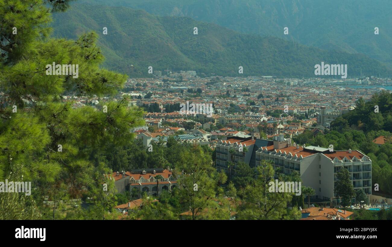 Mountain town panoramic view. landscape with a city between the hills ...