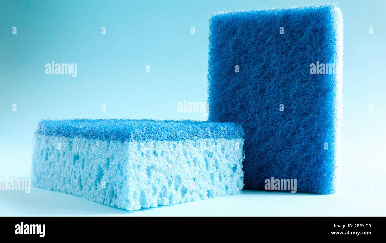 Two blue sponges used for washing and erasing dirt used by housewives ...