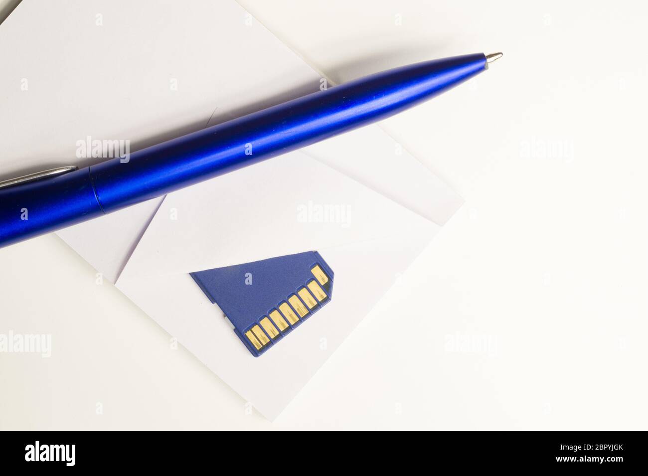 Memory card and blue pen with the paper background Stock Photo - Alamy