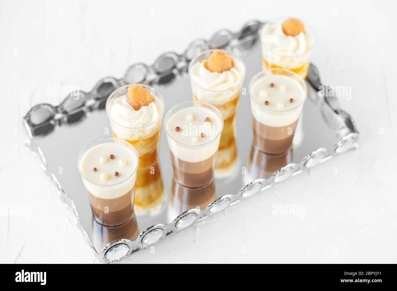 Set of delicious cream desserts. Beautiful tray. The concept of food ...