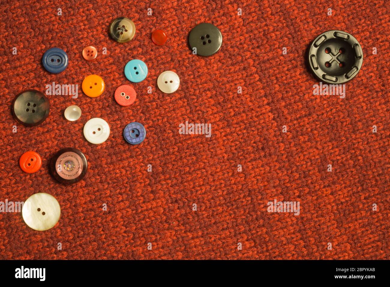 Various sewing buttons on textile background. copy space Stock Photo ...