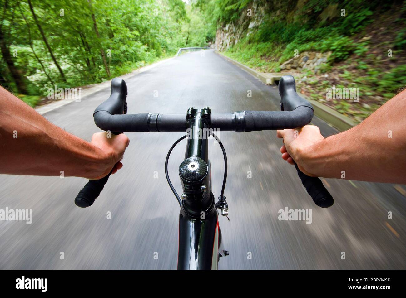 Road cycling wide angle speed shoot in nature. Landscape cycling in ...