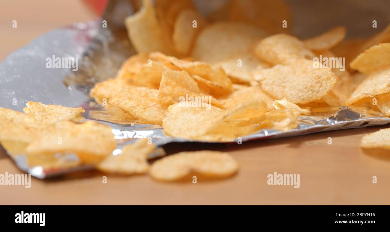 Eating potato chip Stock Photo - Alamy