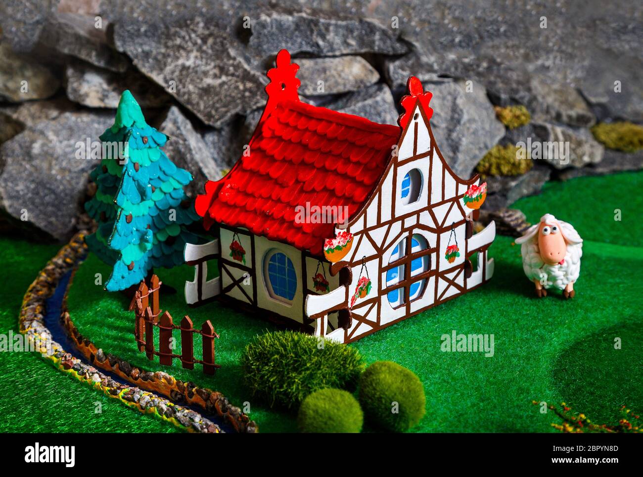 Cardboard house on a toy landscape, on artificial green grass Stock ...