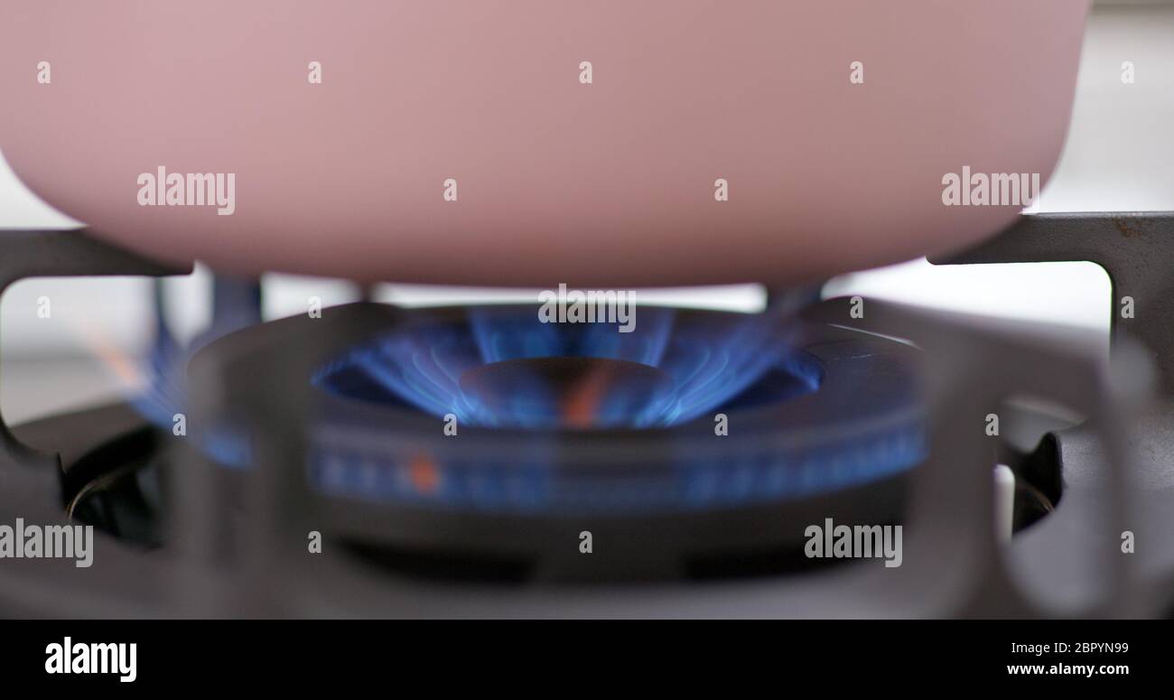 Natural gas inflammation in stove burner Stock Photo - Alamy