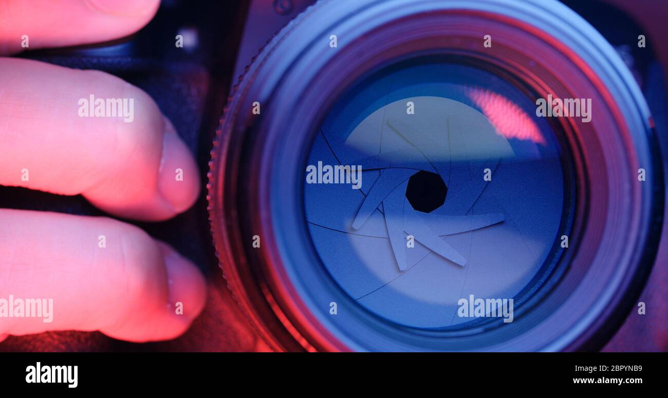 Adjusting Camera lens aperture with pink and purple Stock Photo - Alamy