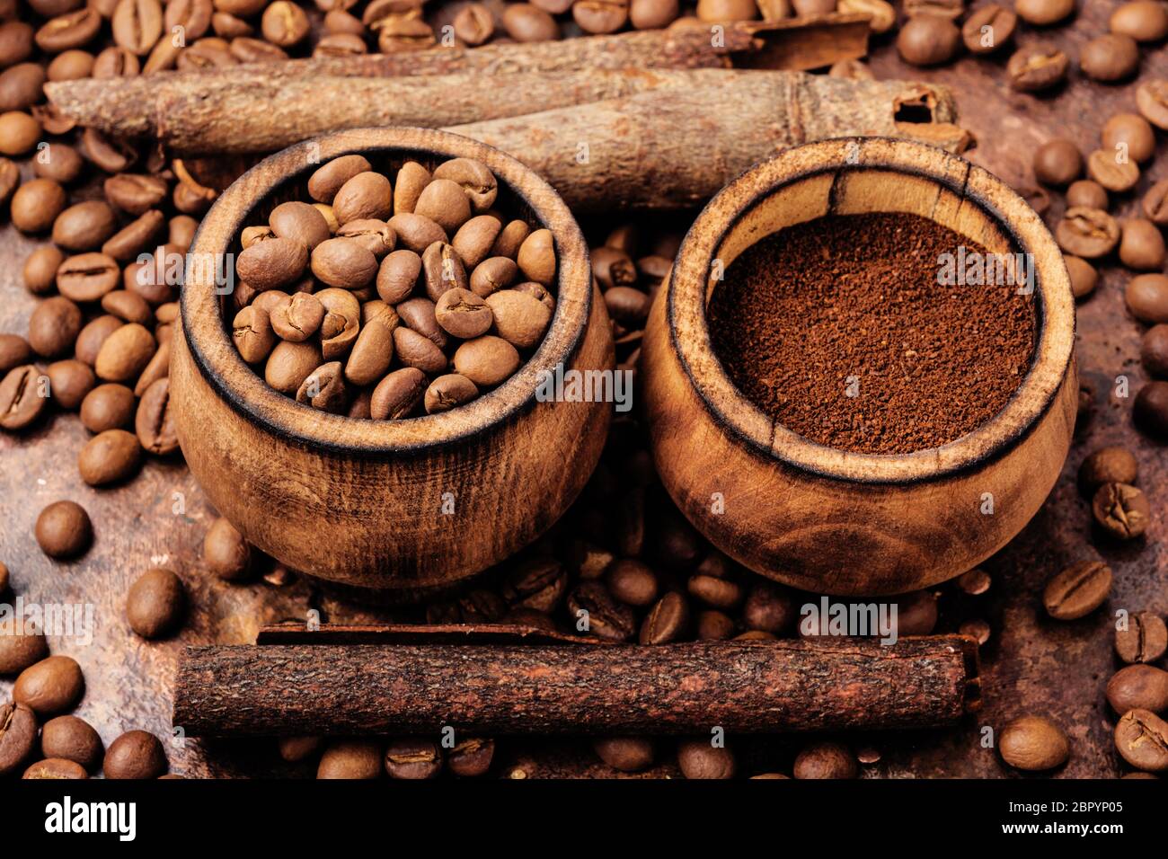 Roasted coffee beans and ground coffee.Dark roasted ground coffee Stock ...