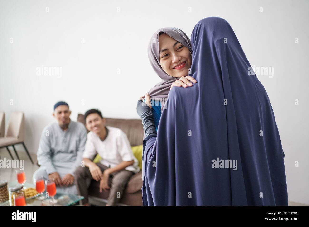 portrait of happy mother hug her daughter during ramadan visit Stock ...