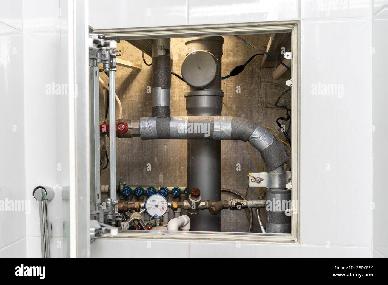 turn off hot water. plumbing cabinet. water meters, collector, water ...