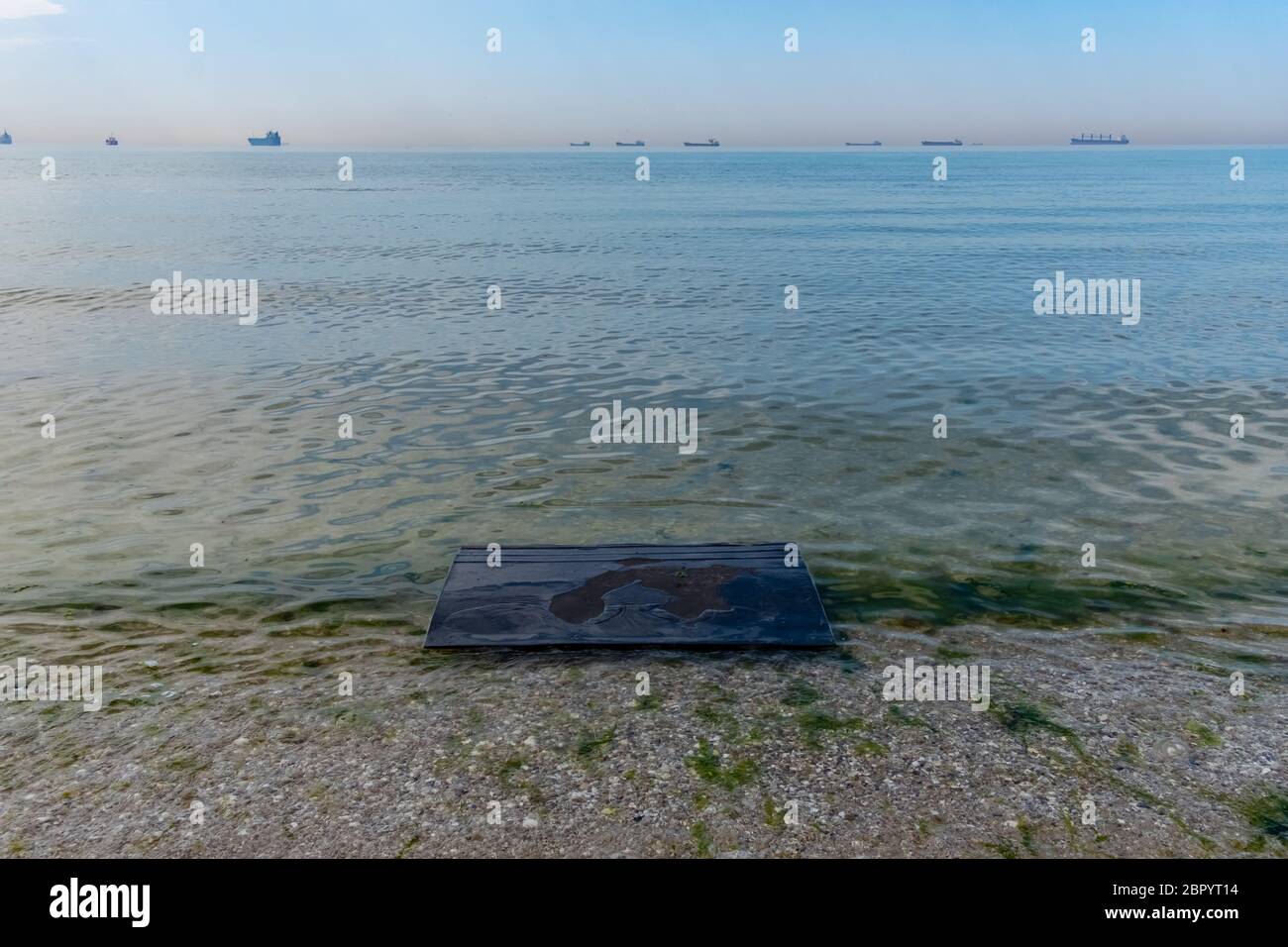 Plastic car mat pollution in sea. (Environment concept). car mat on ...