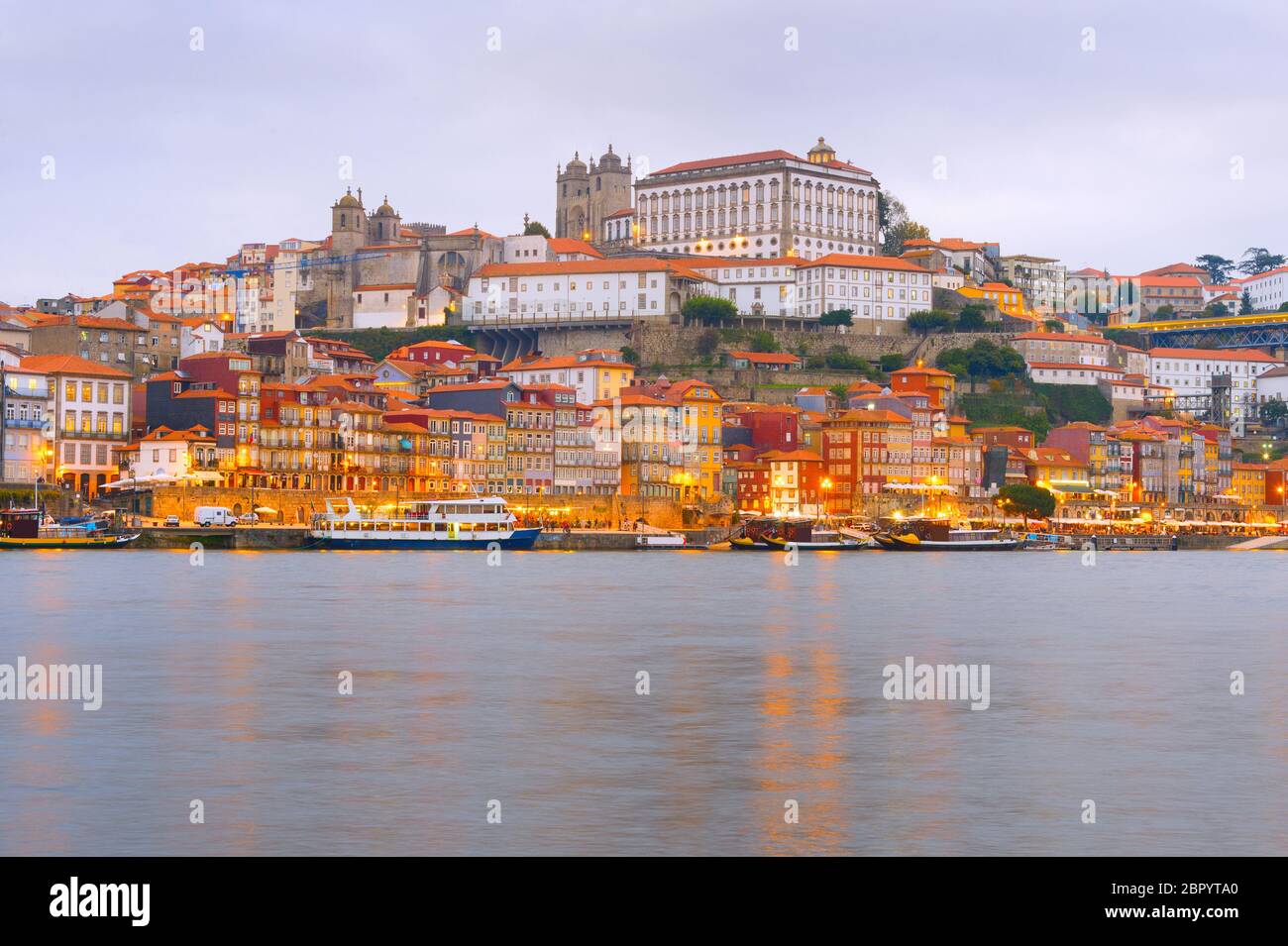 Scenic evening Porto cityscape with Douro embankment and illuminated ...