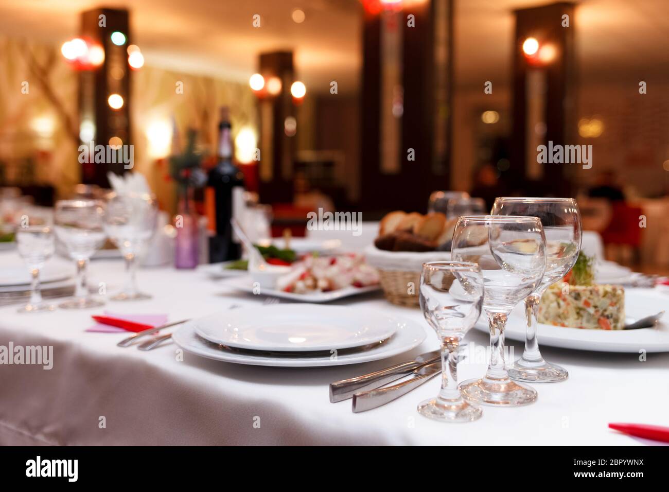 Restaurant tables set for celebration. Many food on the festive table ...