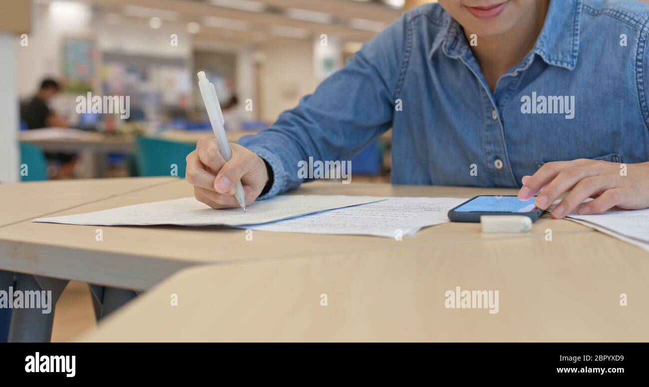 Woman study at library Stock Photo - Alamy