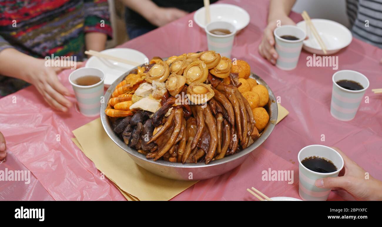 Traditional Chinese family eating big bowl feast together at home Stock ...