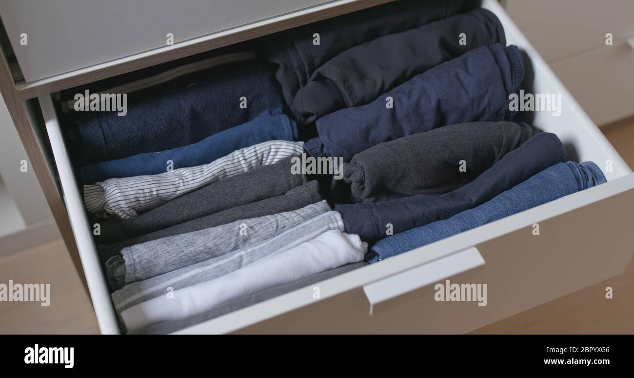 Open the drawer with clothes Stock Photo - Alamy