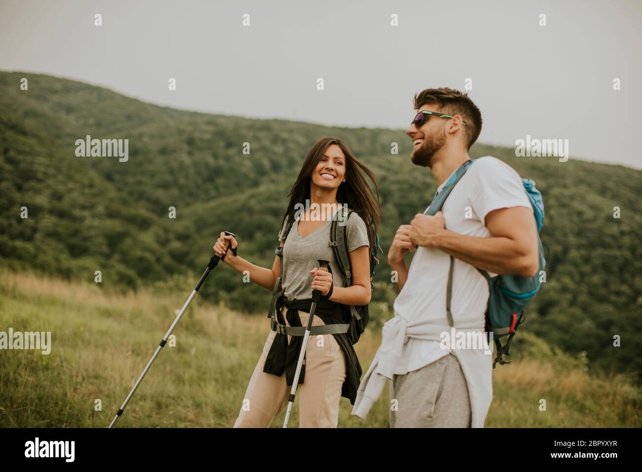 Happy young couple backpacking hi-res stock photography and images - Alamy