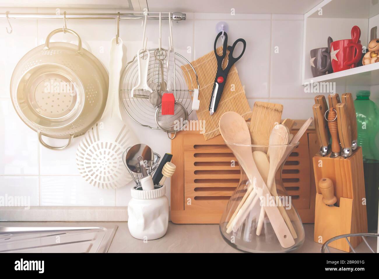kitchen corner with various cooking utensils including a colander ...