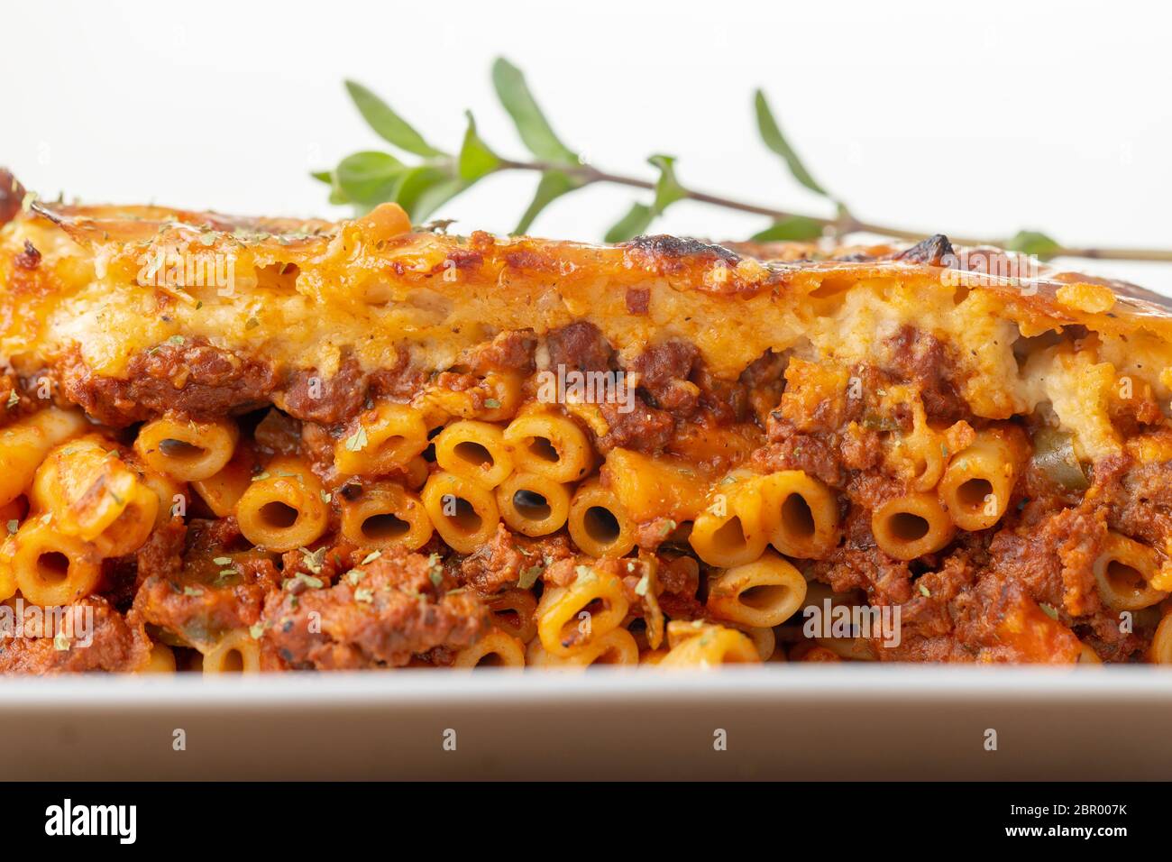 greek pastizio noodle dish with cheese Stock Photo - Alamy