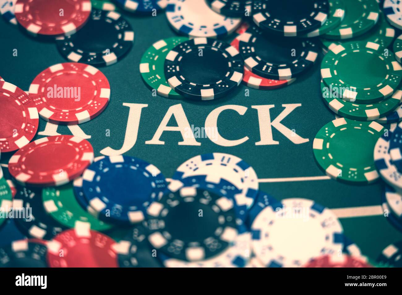 Casino chips on a gaming table Stock Photo - Alamy