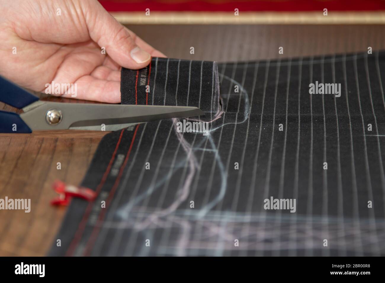 Tailor cutting cloth hi-res stock photography and images - Alamy