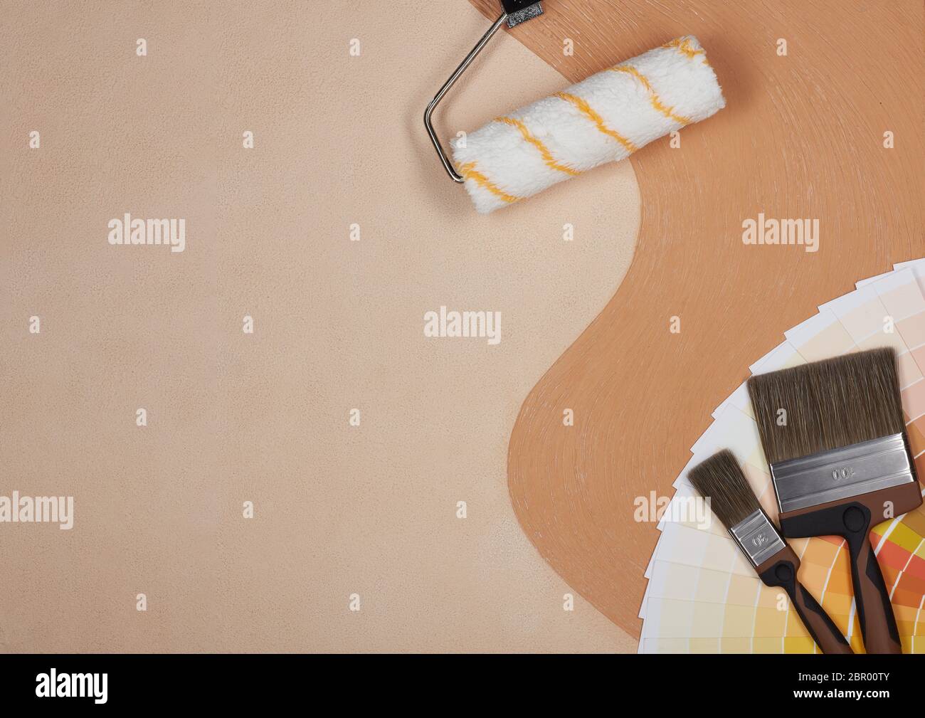 Color palette guide, paint brushes and roller lying on textural double ...