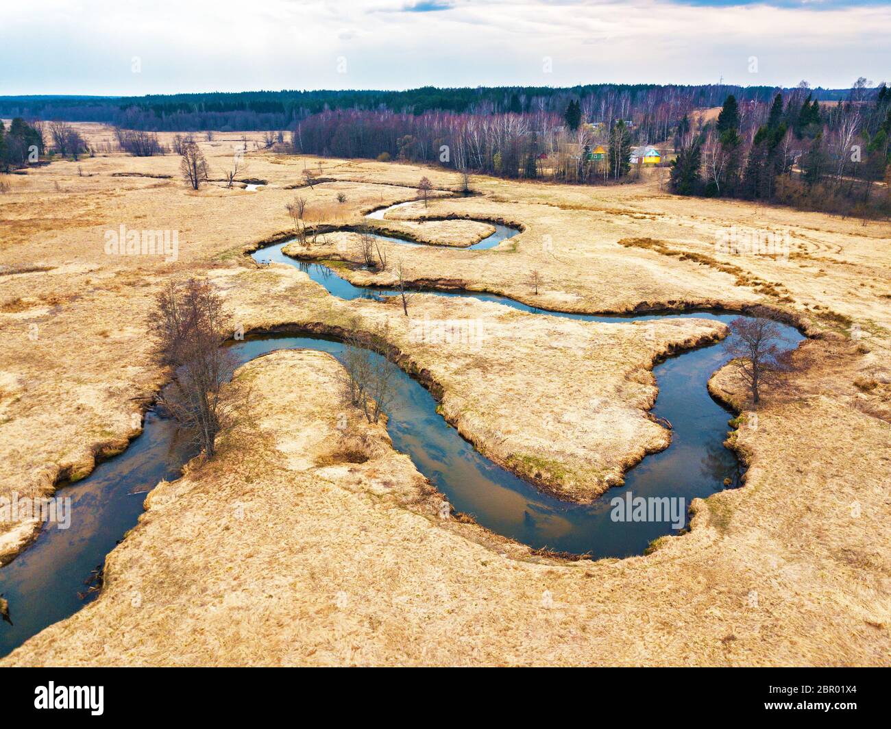 Rural landscape in april. Small River Sula in early spring. Aerial view ...