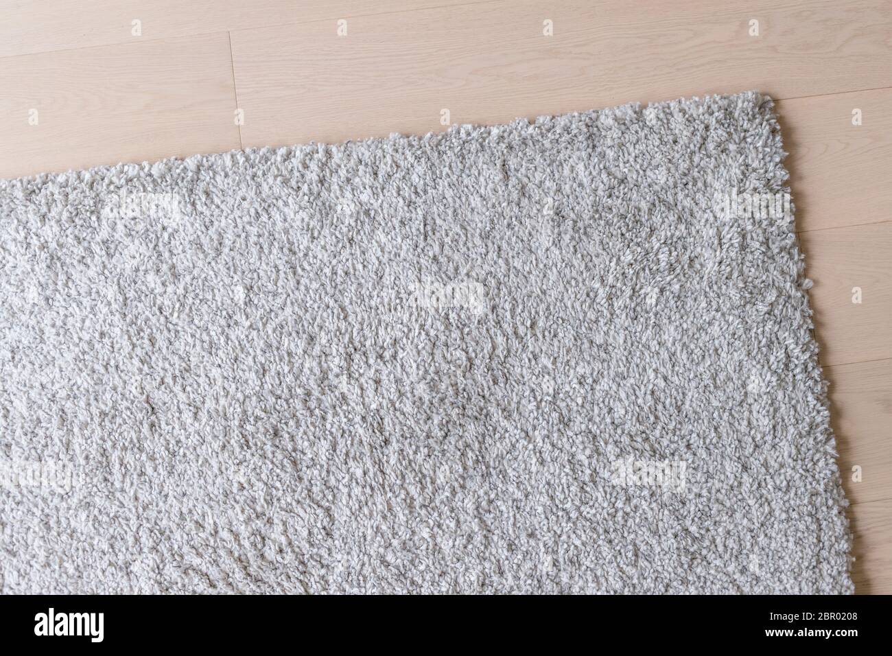 Beige furry carpet Stock Photo - Alamy