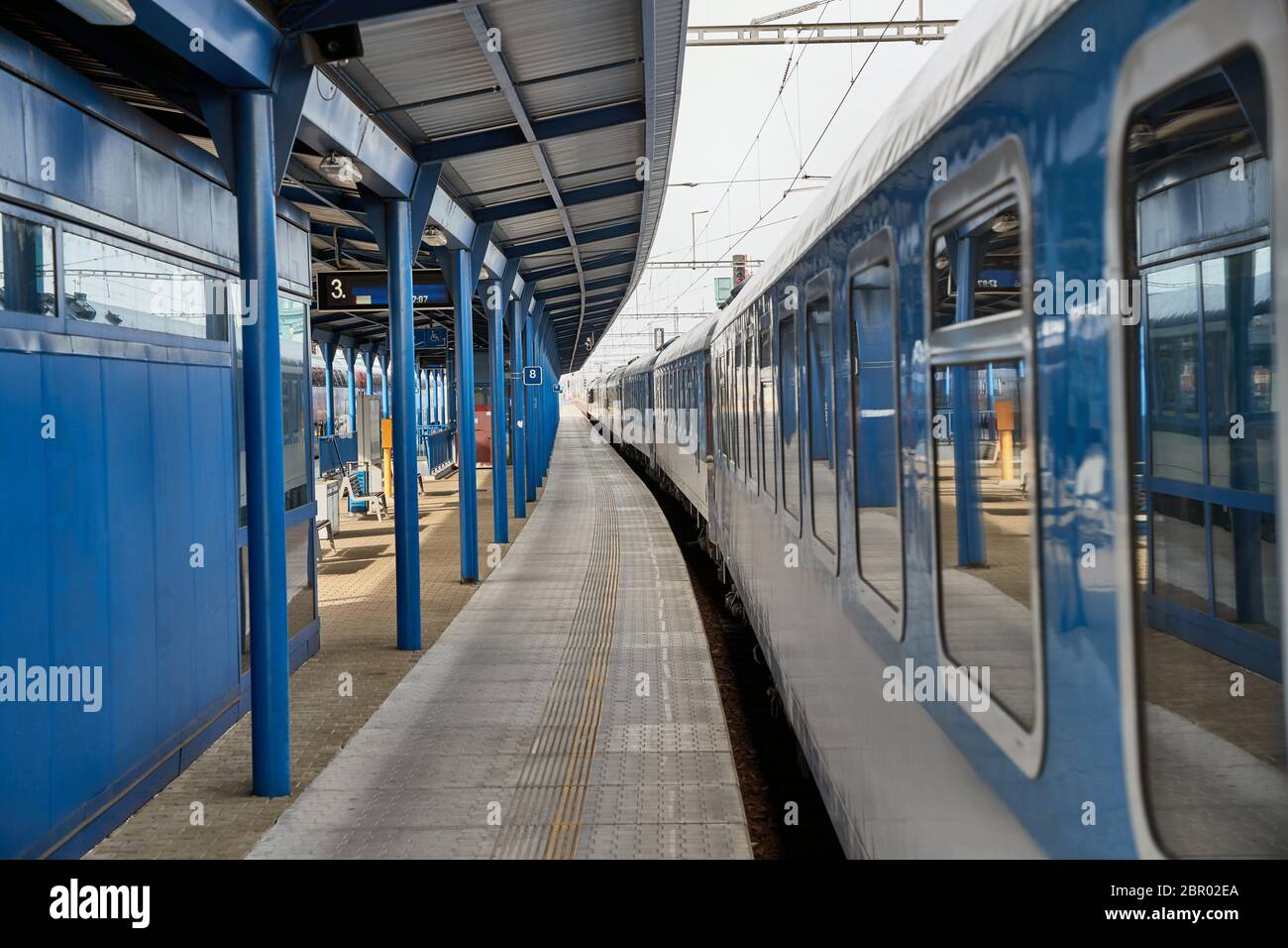 Passanger train at a station platform Stock Photo - Alamy