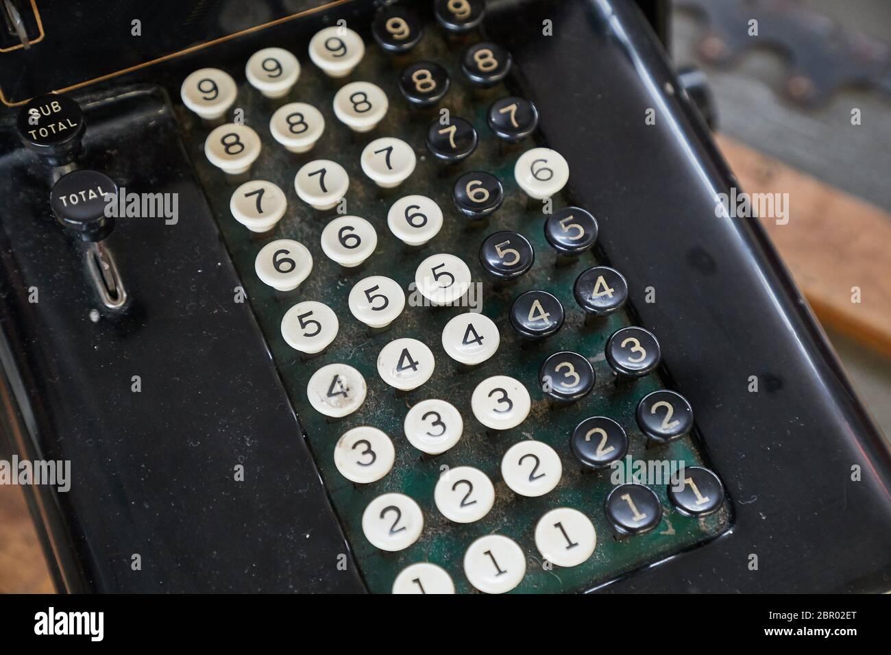 Vintage calculator and cash register on a counter Stock Photo - Alamy