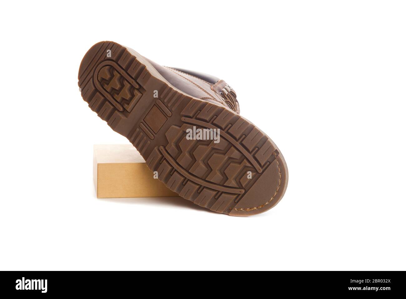 Brown boots sole. Isolated on a white background Stock Photo - Alamy