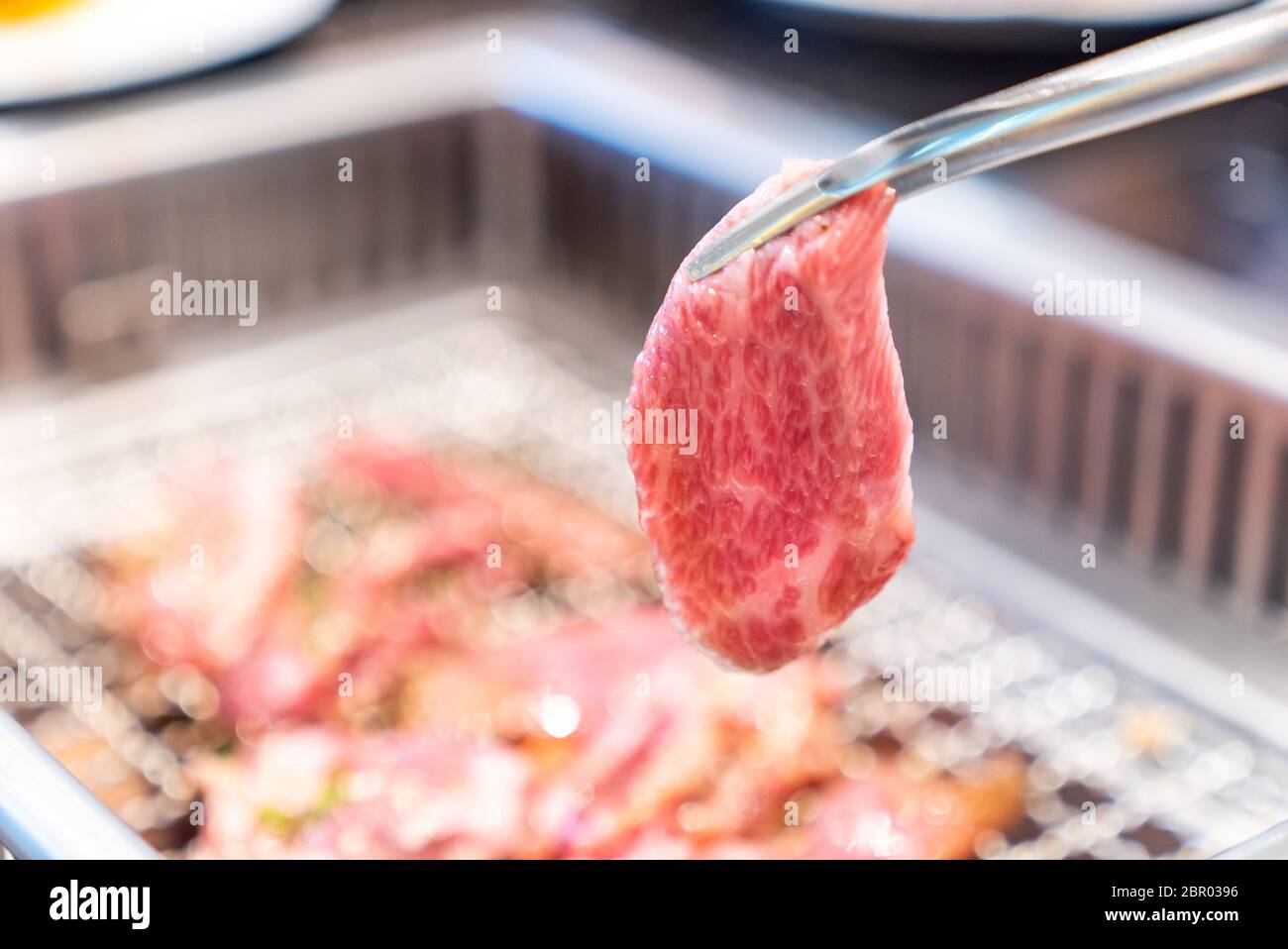 grilled japanese wagyu premium beef yakiniku with red hot charcoal ...