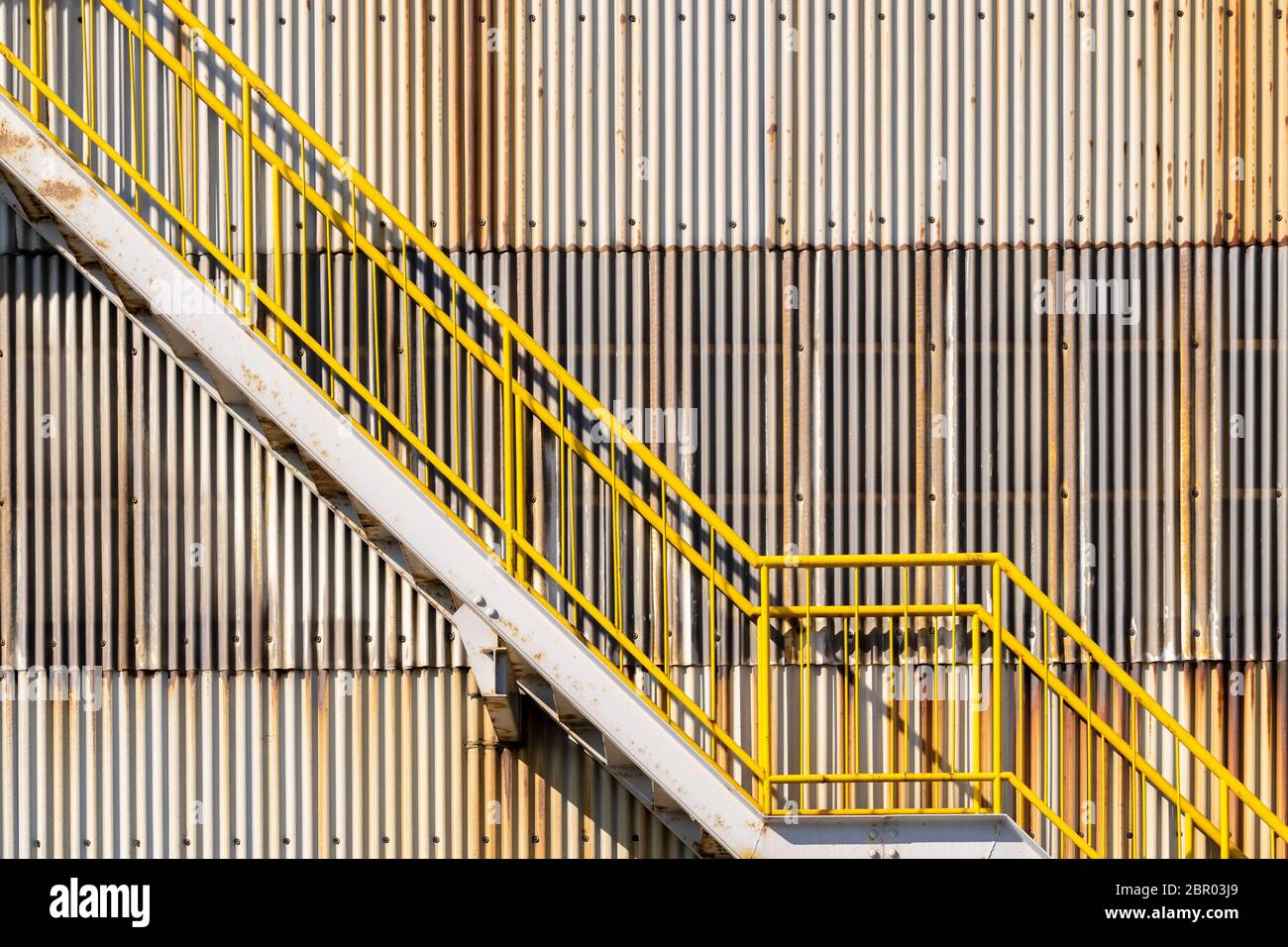 exterior of metal sheet warehouse wall and fire exit stair Stock Photo ...