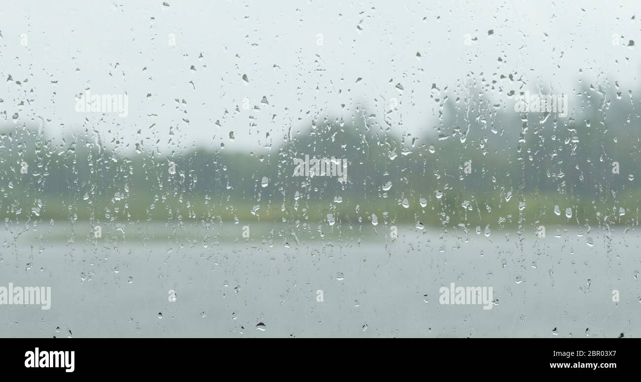 Window view with raining outside Stock Photo - Alamy