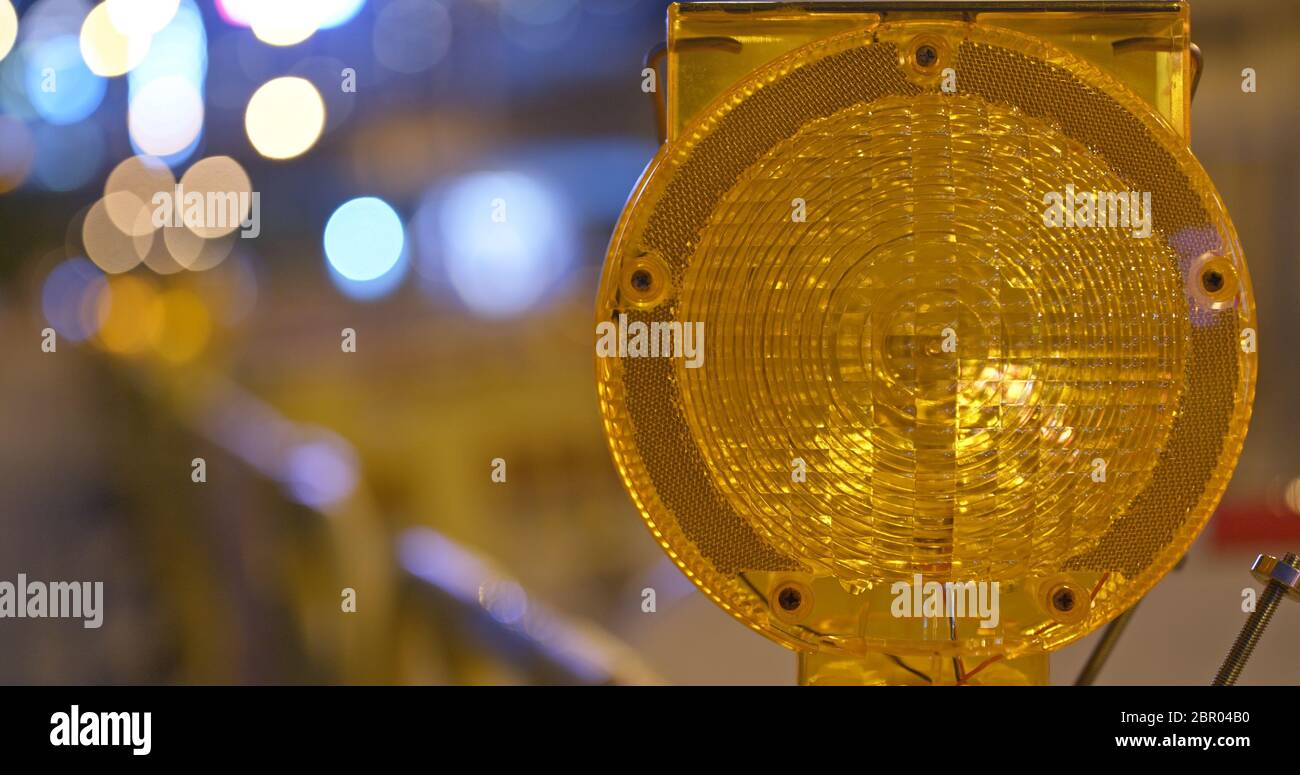 Yellow caution light in the street at night Stock Photo - Alamy
