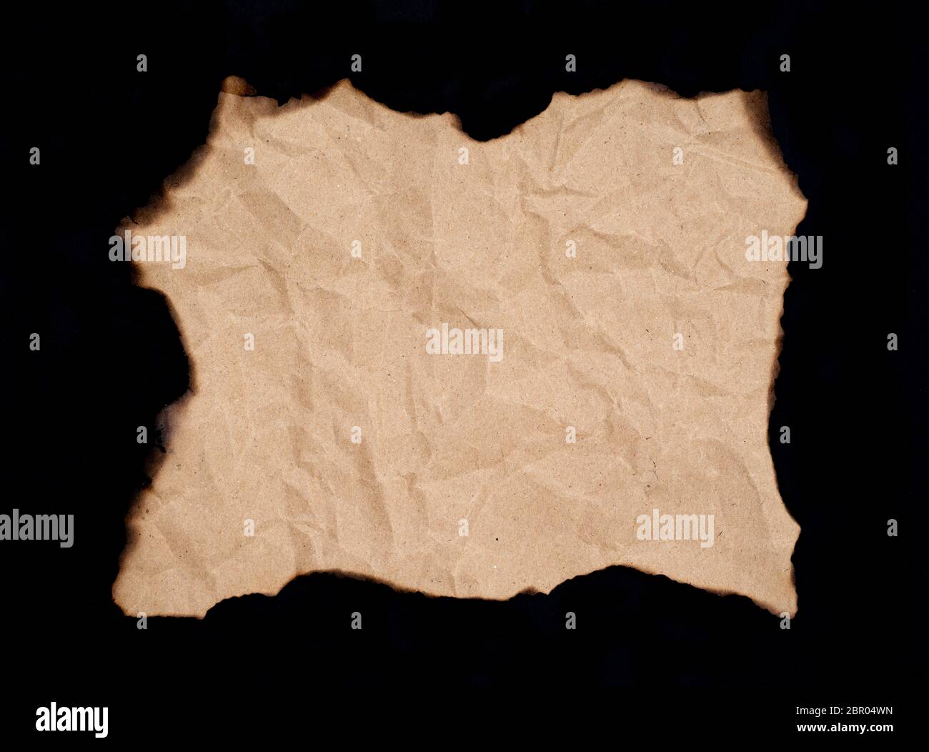 burnt paper sheet isolated on black background Stock Photo - Alamy