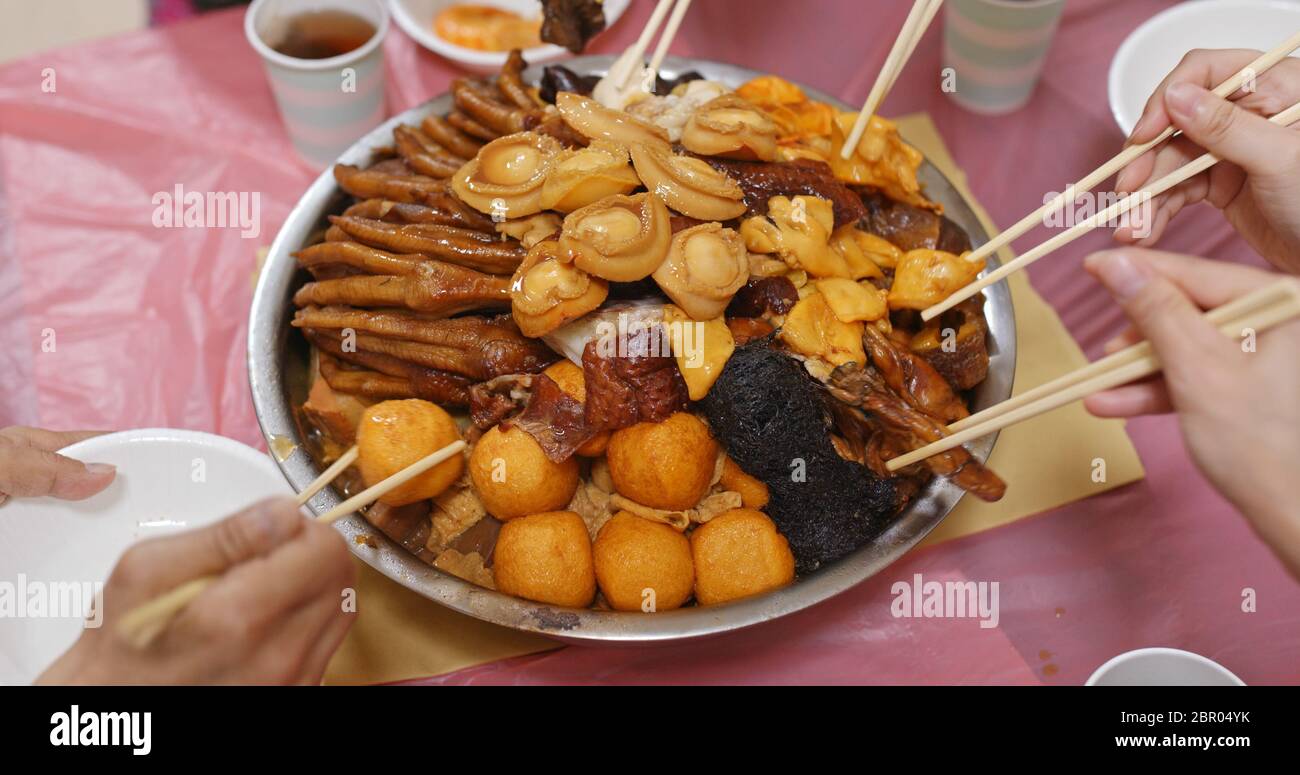 Traditional Chinese family eating big bowl feast together at home Stock ...