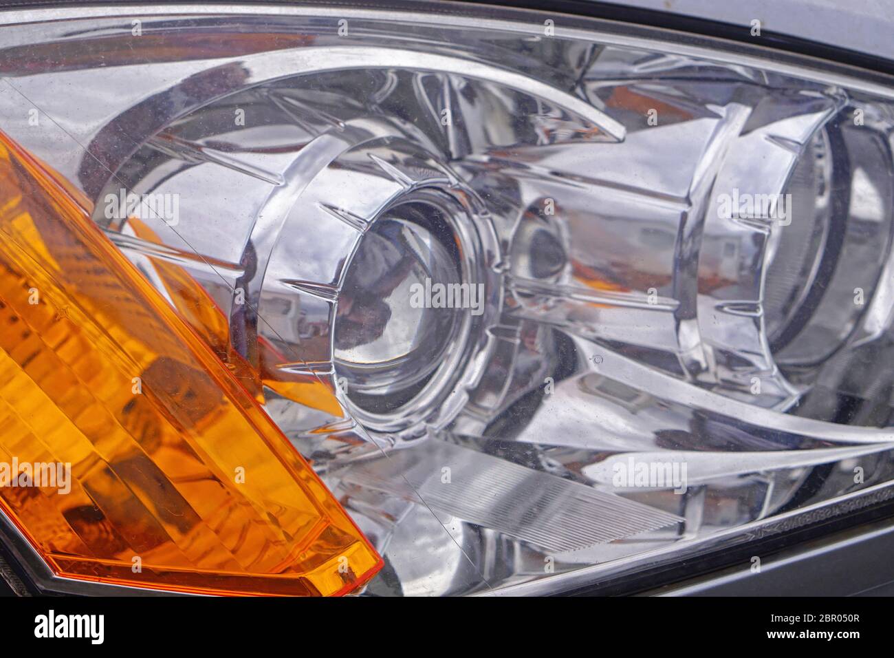 Modern front headlights with lens projectors glass Stock Photo - Alamy